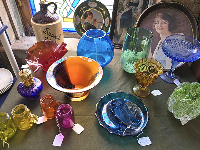 A kaleidoscope of vintage glassware catches the light, each piece holding memories of dinner parties and holiday gatherings long past.