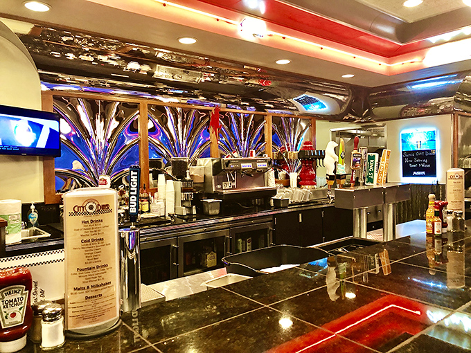 Chrome dreams and coffee steam. The bar area gleams with enough polished metal to make a '57 Chevy jealous.