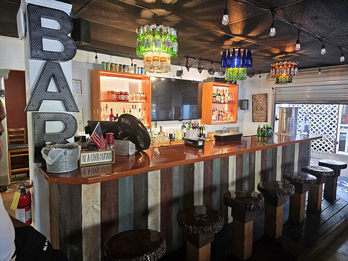 The bar doesn't just serve drinks—it tells stories through bottles and reclaimed wood, inviting you to stay for "just one more."