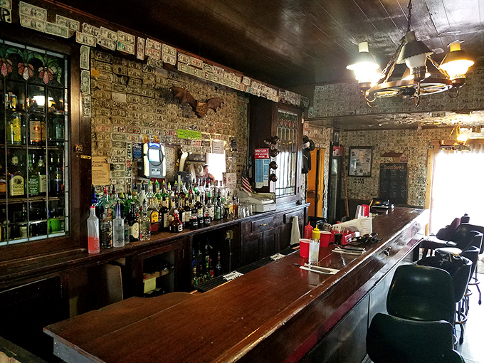 A bar that doesn't just serve drinks&mdash;it tells stories through dollar bills on walls and the warm glow of pendant lights.