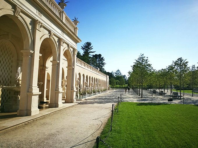 The colonnade offers elegant shade and architectural drama. Like walking through history with better landscaping than Versailles.