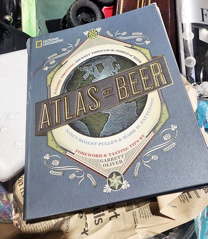 The "Atlas of Beer" &ndash; proof that education comes in many forms at the outlet. Someone's discarded coffee table book is another's happy hour inspiration.