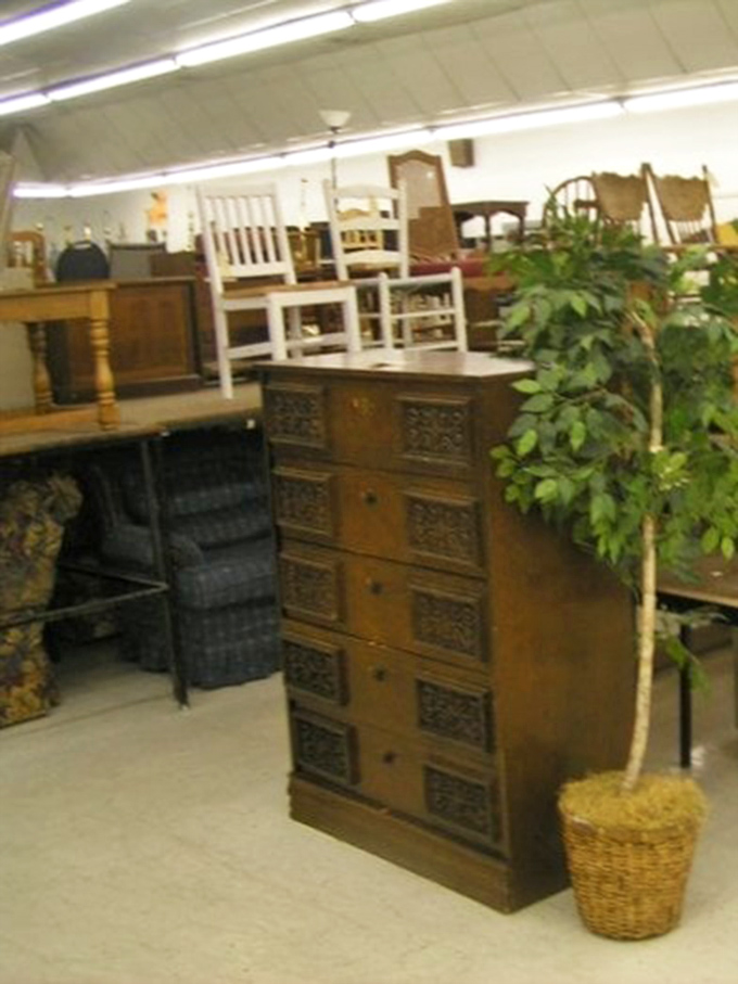 This ornate wooden cabinet whispers of dinner parties past, ready to store your treasures for a fraction of antique store prices.