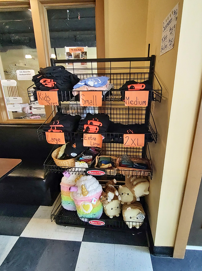 From tiny tees to plush unicorn cats, the merchandise corner offers take-home memories for feline enthusiasts of all ages.