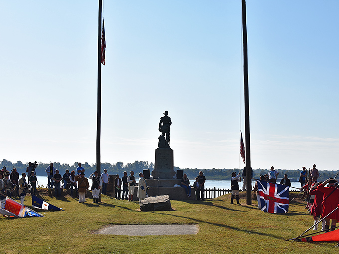 Historical reenactments bring the past to life along the riverfront, complete with period costumes and unfurled flags.