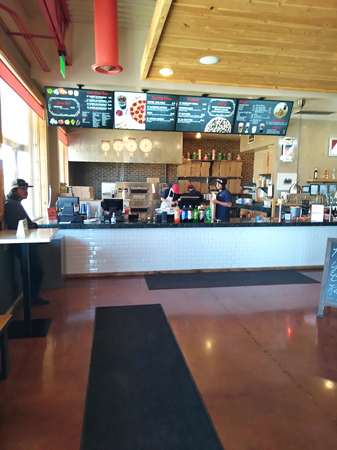 Command central for pizza perfection, where dough-spinning wizards transform simple ingredients into circular works of edible art.