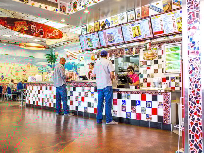 At the counter, red and white checkerboard tiles create the perfect backdrop for ordering your soon-to-be favorite comfort food classics.