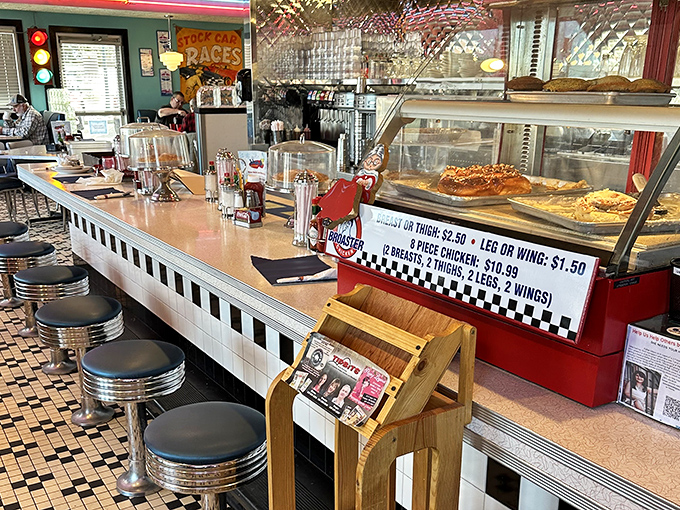 The counter experience: where solo diners become regulars and the pie display case becomes dangerously hypnotic.
