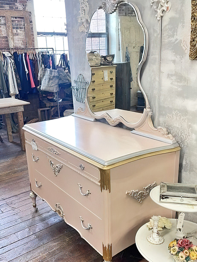 This shabby-chic dresser with ornate mirror transforms from forgotten furniture to statement piece. Someone's trash becomes another's treasure.