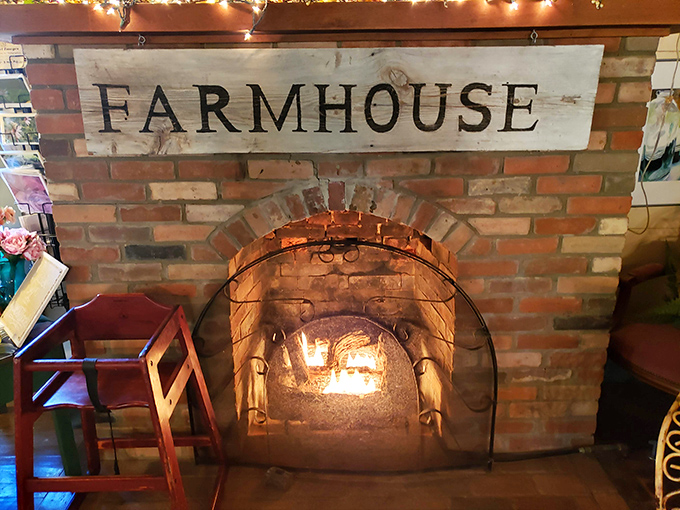 Nothing says "welcome home" quite like a brick fireplace with the word "FARMHOUSE" proudly displayed above the dancing flames.