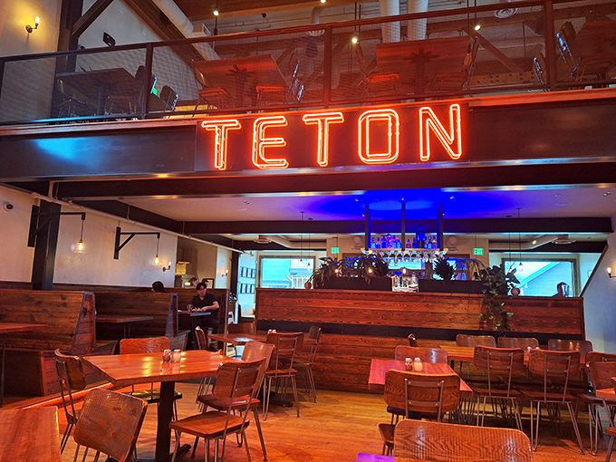 The glowing "TETON" sign reminds you that great pizza can happen anywhere - even in a former movie theater in Wyoming.
