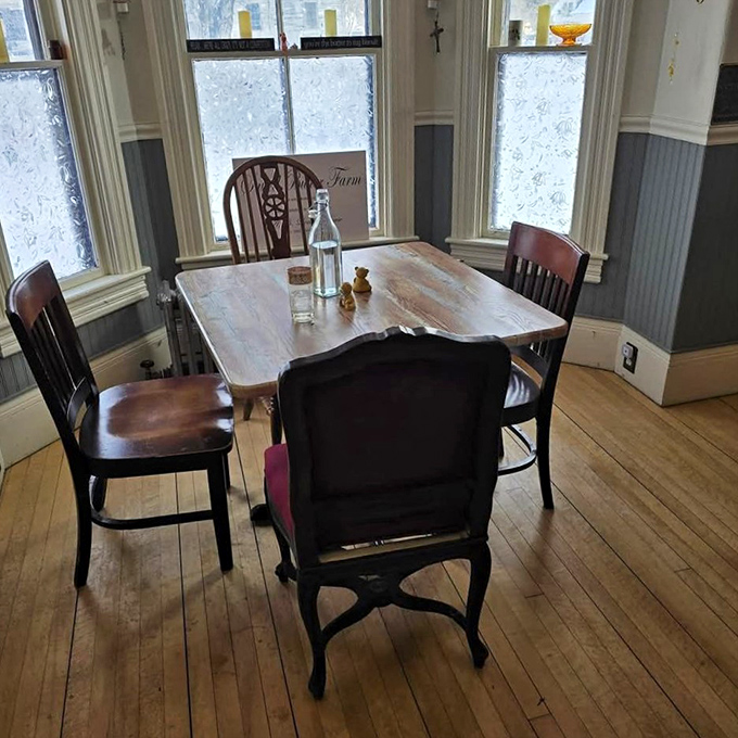 A table by the window where winter light dances across wooden surfaces, promising intimate conversations and memorable meals.