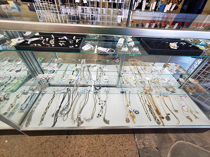 The jewelry counter&mdash;where patience pays off. Real silver and costume pieces coexist in glass-case harmony.