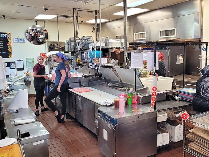 A glimpse into the engine room of flavor. Notice the staff's focused expressions&mdash;they're not just cooking, they're crafting.