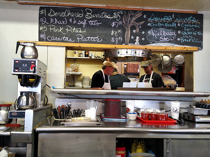 Behind the scenes where the magic happens &ndash; a kitchen board announcing daily specials that locals plan their schedules around.