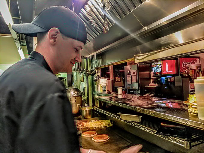 Behind every great breakfast is a focused kitchen maestro. Where pancake batter becomes morning gold through practiced hands.