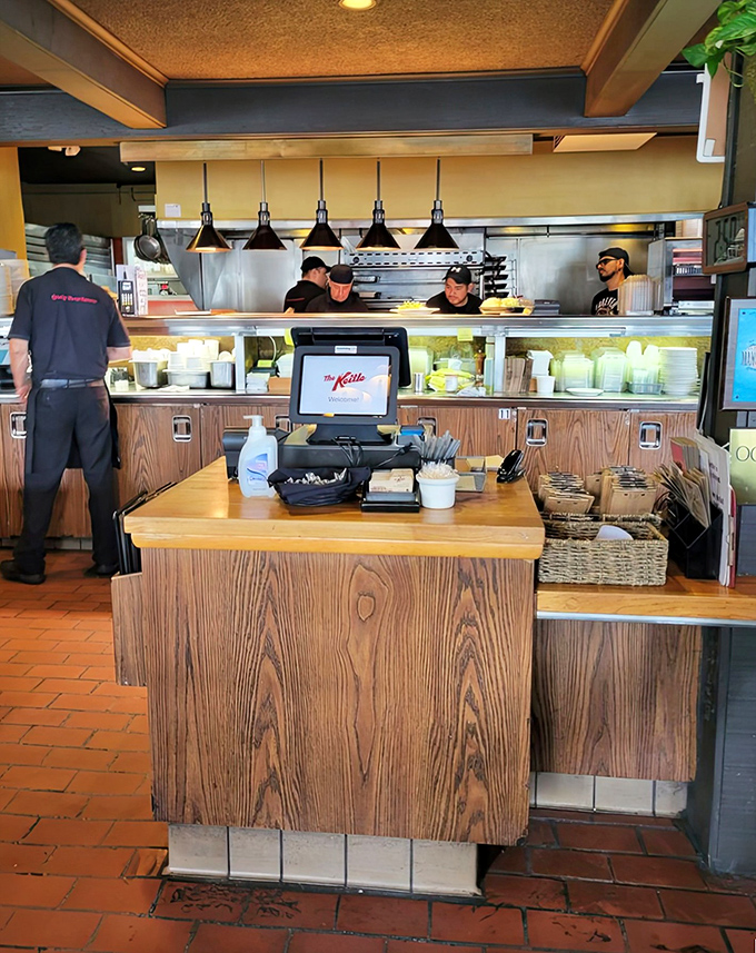 The open kitchen hums with efficiency as the team plates up dishes &ndash; breakfast theater at its finest, folks.