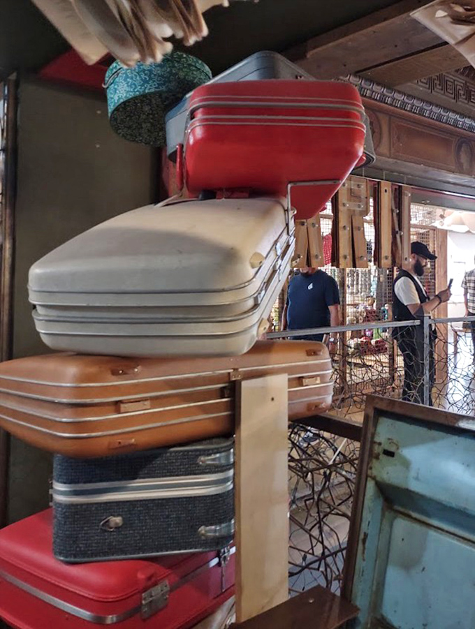 Vintage suitcases stacked like a Wes Anderson film set. Pack your literary treasures for imaginary journeys to fictional lands.