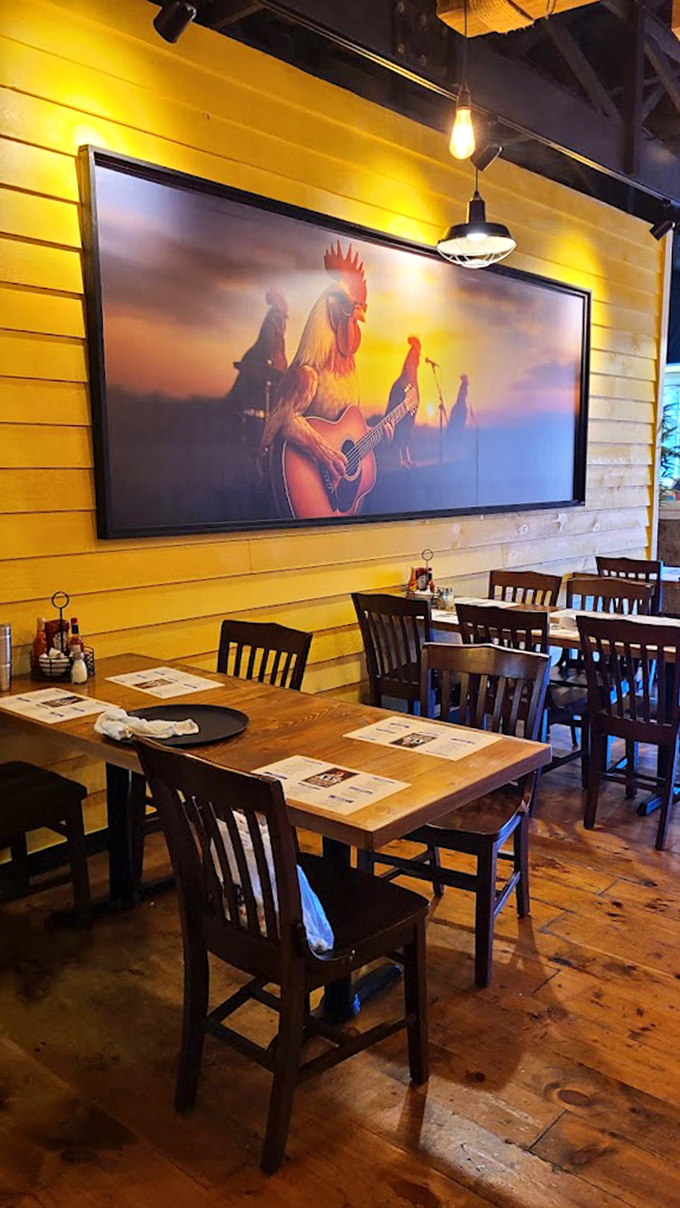 Yellow walls and a guitar-playing rooster artwork create a quirky, welcoming vibe that says, "Yes, breakfast can be fun!"