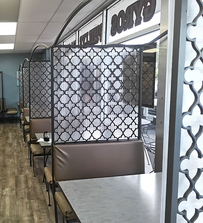 These decorative dividers create semi-private dining nooks&mdash;a thoughtful touch that transforms a simple space into something with a bit more character and intimacy.