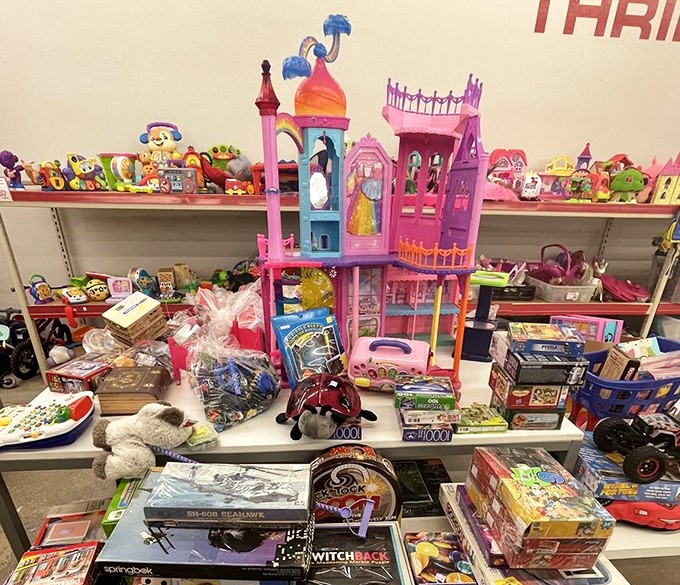 Toy shelves bursting with childhood dreams&mdash;where princess castles and race cars await their next adventure with new owners.