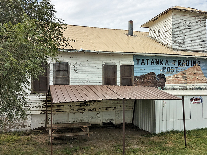 The Tatanka Trading Post's faded paint tells of busier days when travelers and locals gathered to exchange goods, stories, and frontier news.