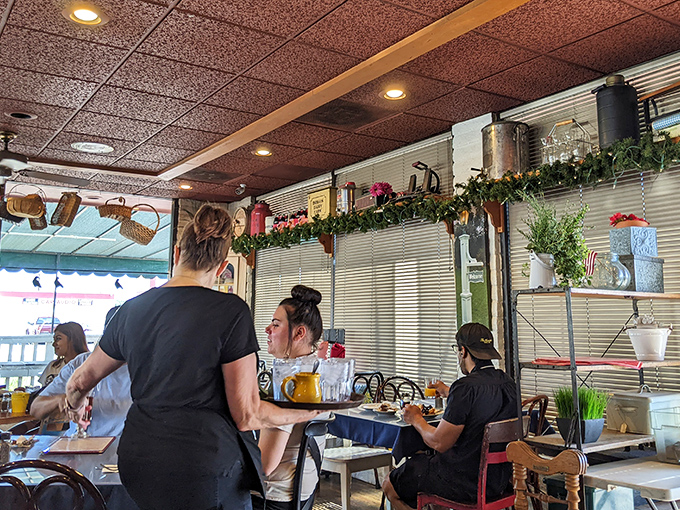 Where breakfast magic happens. The servers navigate this choreographed dance of coffee refills and plate deliveries with the precision of Broadway performers.