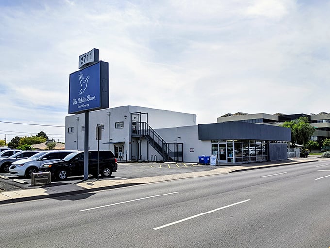 White Dove's distinctive blue sign stands out like a beacon for those seeking quality secondhand treasures.