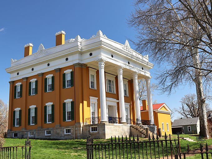 The golden-hued historic mansion in Madison stands proudly on its hill, a reminder of the town's prosperous riverboat days.