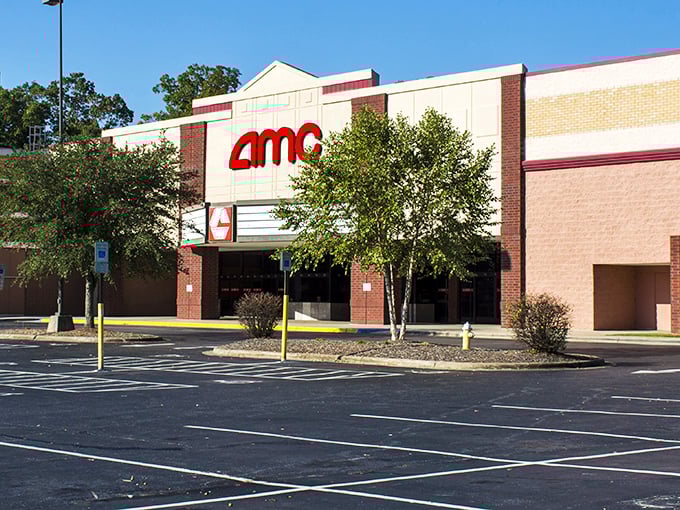 The AMC Hickory 15 stands ready for rainy day entertainment, where buttery popcorn and Hollywood dreams await behind those doors.