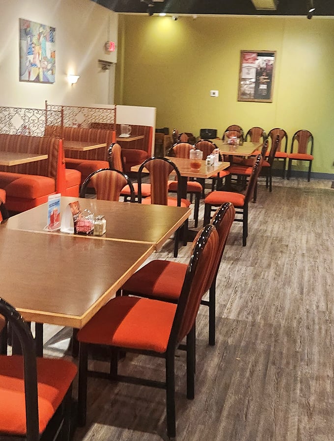 Another dining area offers comfortable seating with warm colors that say "stay awhile" rather than "eat and run."