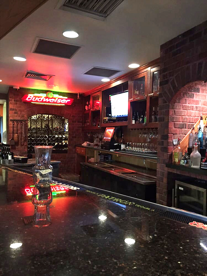 The bar area glows with promise, offering liquid courage before you commit to that 25-ounce porterhouse challenge.