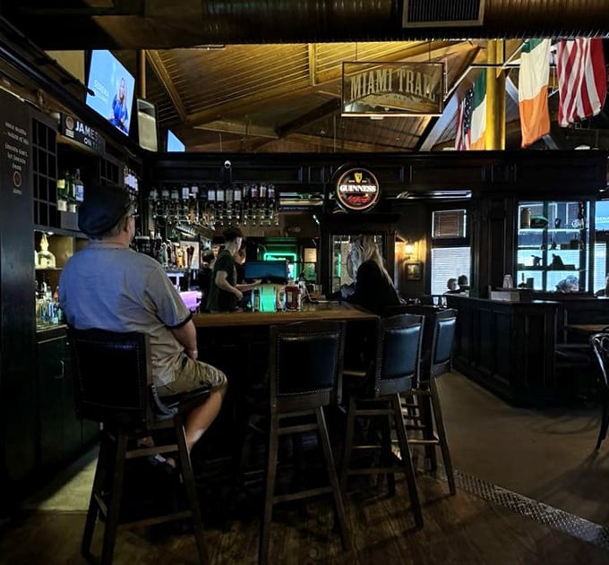 The bar area &ndash; where Guinness signs glow like beacons and the stools have witnessed countless stories, jokes, and maybe a few tall tales.