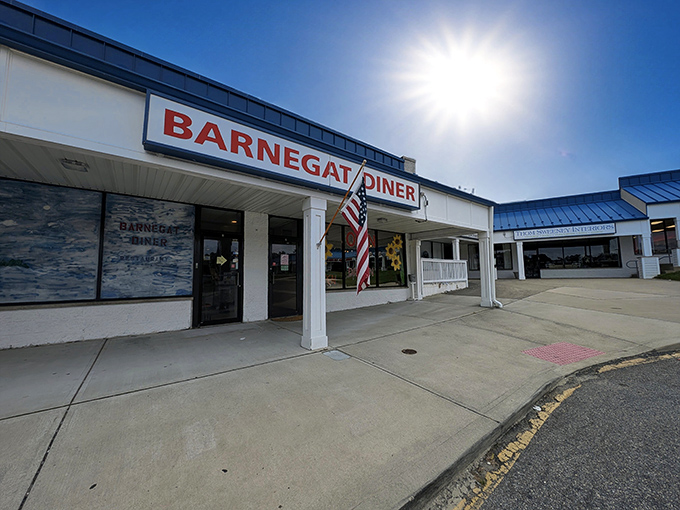 The Barnegat Diner stands ready to serve breakfast classics under the morning sun, where locals gather for pork roll debates and bottomless coffee.