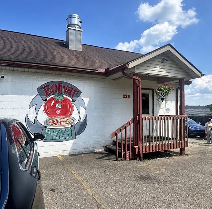Bolivar Pizza's cheerful tomato mascot has likely witnessed countless family celebrations—a small-town institution where memories are made one slice at a time.