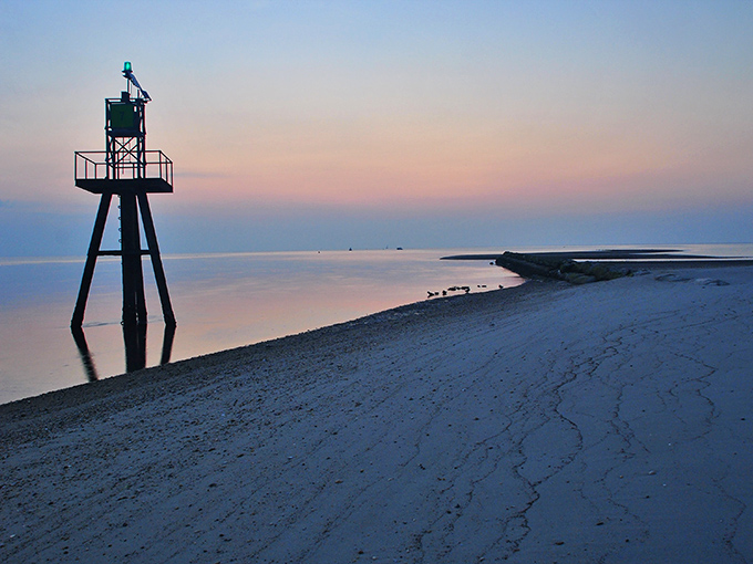 Sunset paints the navigation marker and shoreline in pastel hues. Nature's way of saying, "You made the right choice by coming to Bowers Beach today."