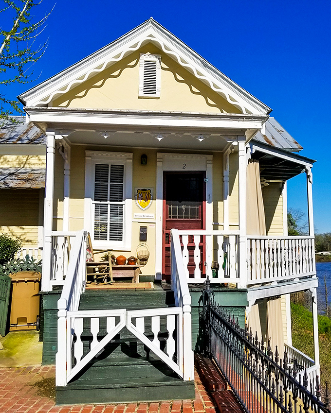 This charming yellow cottage with its pristine white porch railings embodies the architectural character that makes Selma's historic neighborhoods so captivating.
