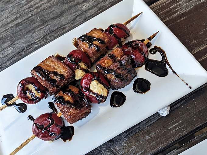 Chislic skewers with balsamic drizzle&mdash;proof that meat on sticks remains humanity's greatest culinary achievement since fire.