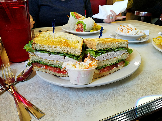 The club sandwich&mdash;architecture you can eat! Triple-decker construction with layers of turkey, veggies, and mayo that somehow stays together until the last bite.