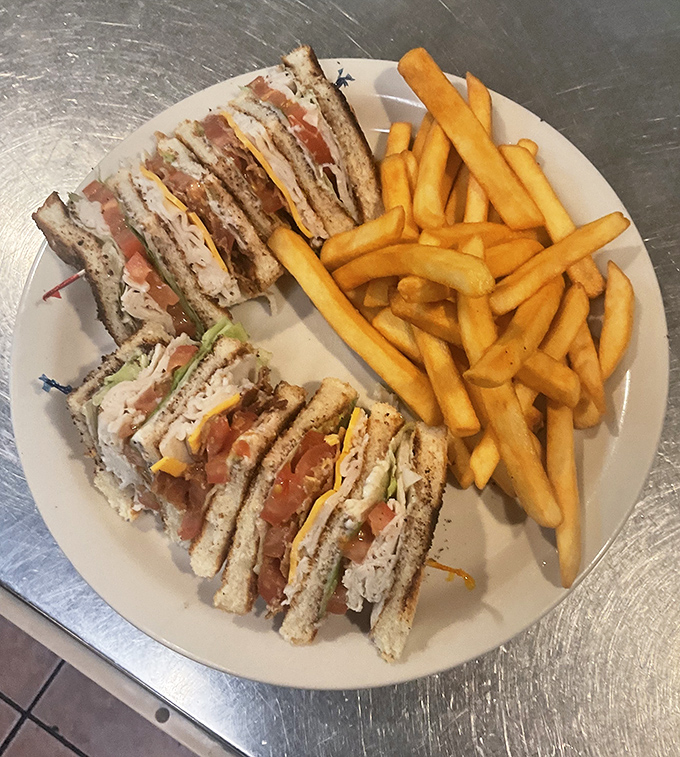 A club sandwich stacked higher than some of Phoenix's buildings, proving that architecture isn't just for skylines.