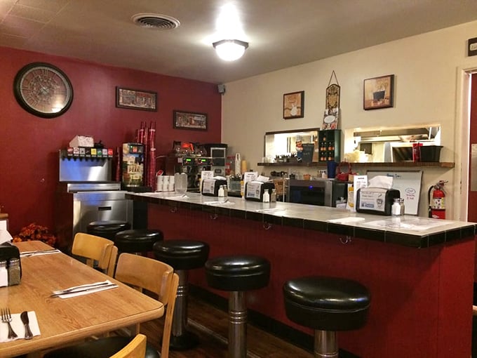 The counter seating&mdash;where breakfast solo artists perform their symphony of coffee sipping and menu contemplation under classic diner lighting.
