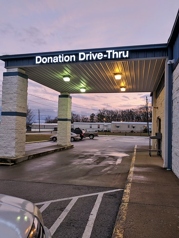 The donation drive-thru at twilight – where yesterday's treasures begin their journey to tomorrow's bargain hunters. Retail circle of life in action.
