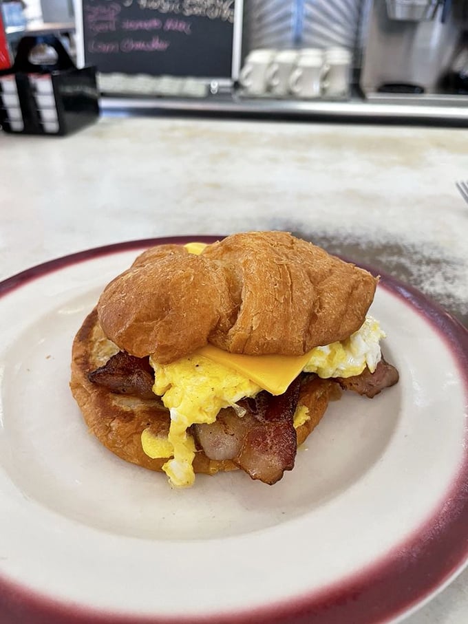 This breakfast croissant sandwich doesn't just say good morning—it shouts it with bacon, egg, and cheese on a buttery throne.