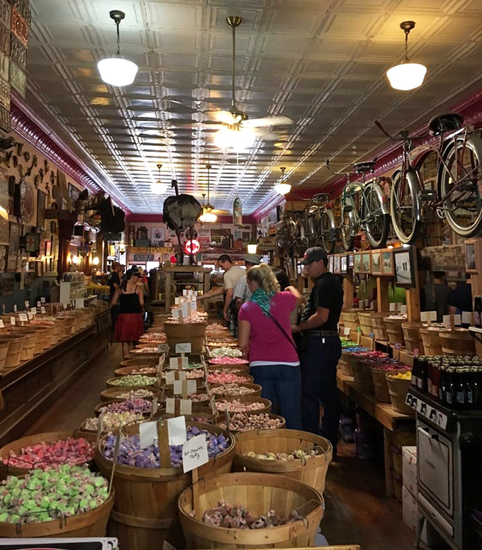 Under pressed tin ceilings, candy pilgrims gather at the barrels for their sweet communion.