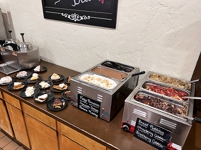 The dessert station stands ready like a sweet militia prepared to battle any notion that you might leave without something sugary.