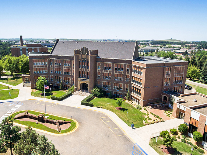 Dickinson State University's stately brick campus stands as proof that impressive architecture doesn't require a six-figure tuition bill to appreciate.
