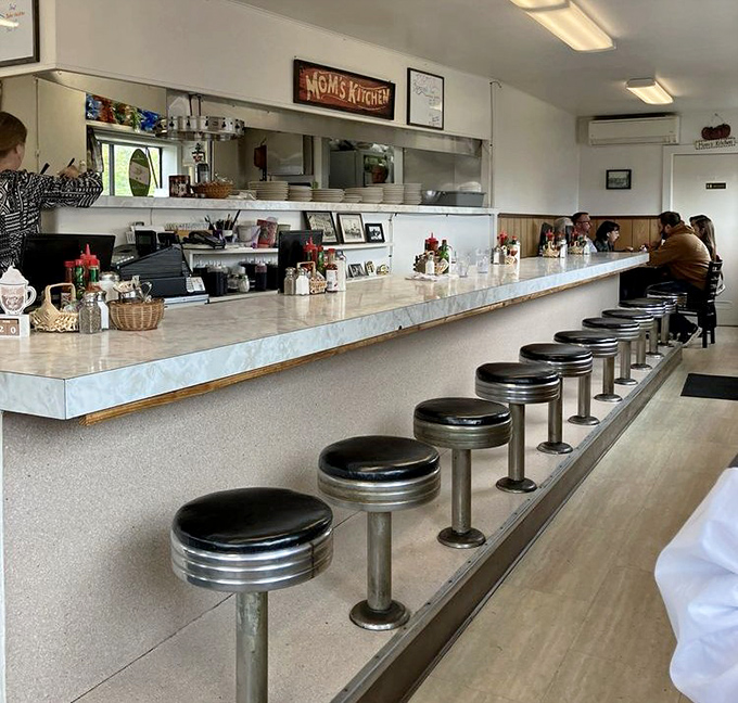 The counter seating &ndash; where solo diners become temporary neighbors and the coffee flows as freely as the conversation.