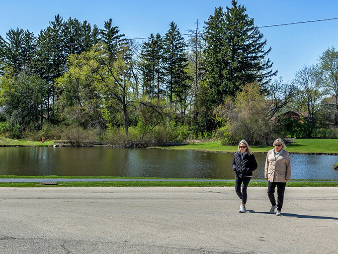 Peaceful waters reflect the sky as visitors stroll along the shore. Nature's version of meditation, just minutes from historic downtown.