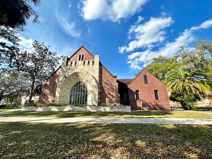 First Presbyterian's brick fa&ccedil;ade and dramatic arched entrance speak to Bartow's architectural heritage, standing sentinel under Florida's dramatic cloud-scattered sky.