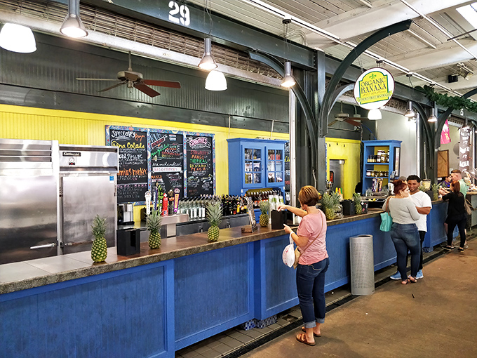 The market's food court serves up refreshment with a side of local flavor, where pineapples stand guard over cooling beverages.